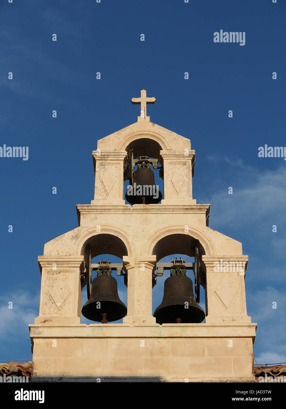stone bell tower with a blue sky background Stock Photo - Alamy