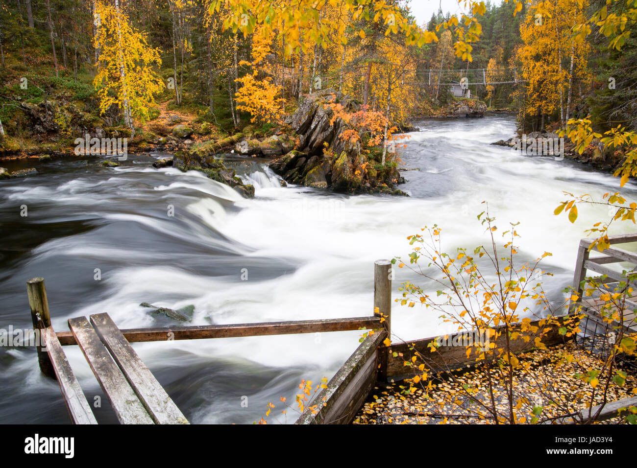 Fast flowing river flow over riffles and rocks Stock Photo - Alamy