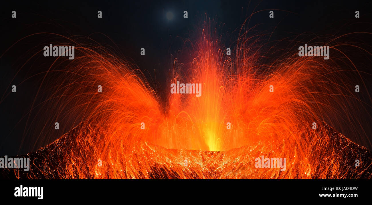 Volcano erupting at night with a very strong eruption Stock Photo - Alamy