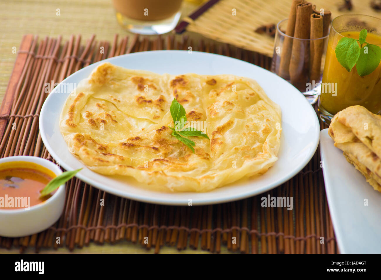 roti canai and teh tarik, very famous drink and food in malaysia Stock ...