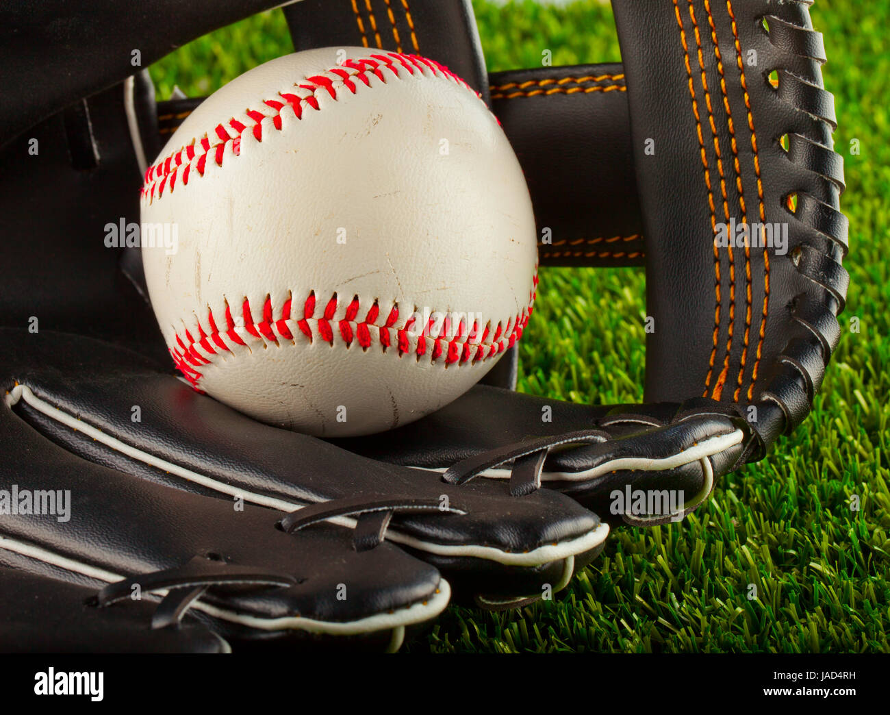 A baseball inside a baseball glove over white background Stock Photo ...
