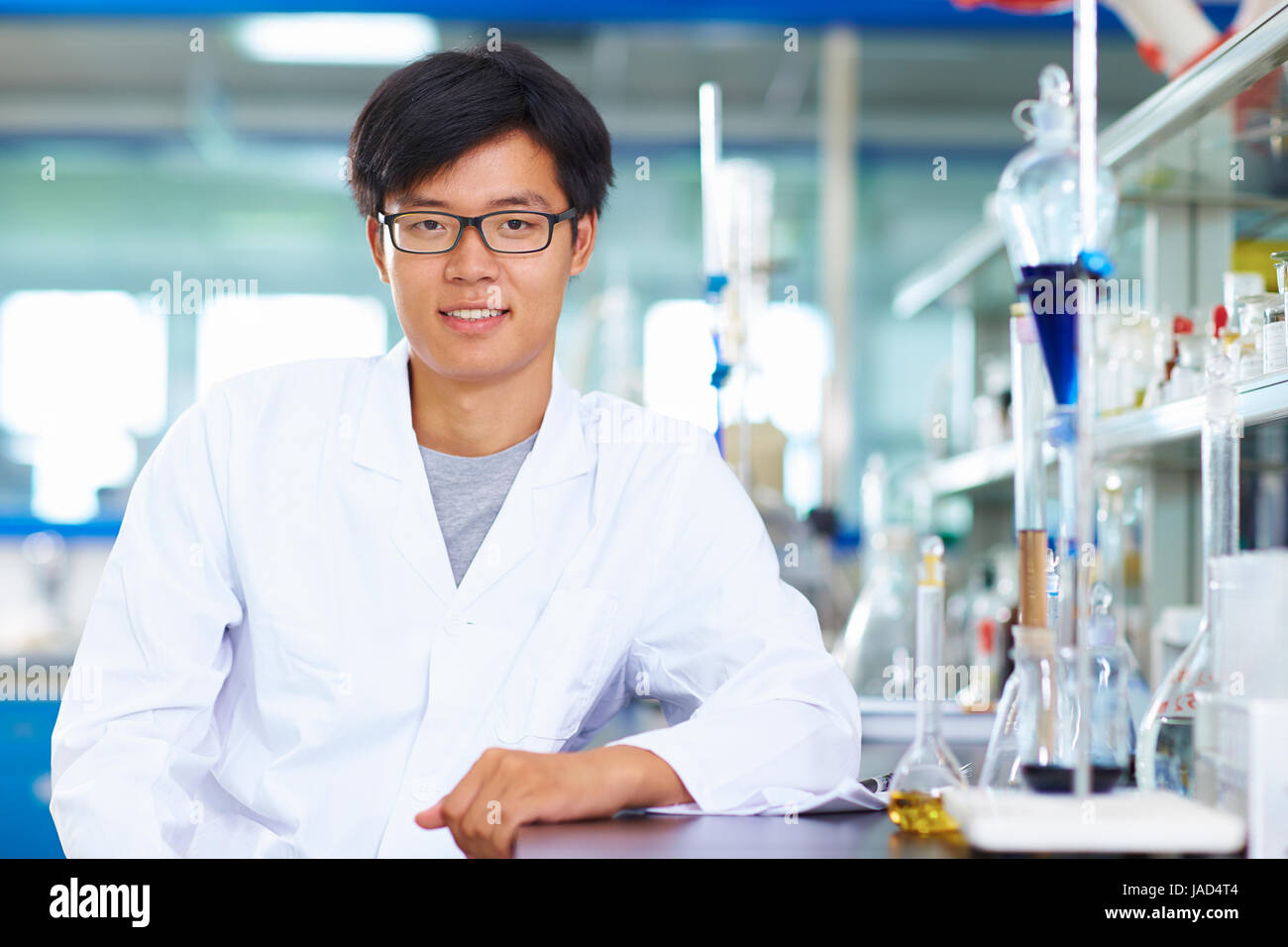 One male Chinese Laboratory scientist working at lab with test tubes ...
