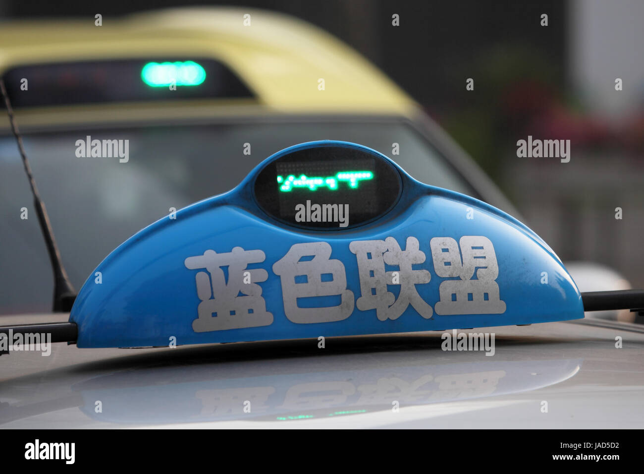 Blue taxi sign in Shanghai, China Stock Photo - Alamy