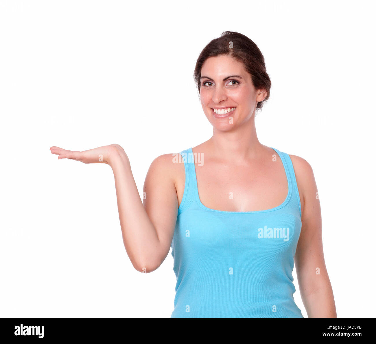 Portrait of a gorgeous young woman holding palm out on white background ...