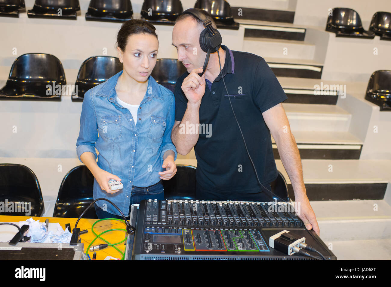 engineers working at mixing desk in recording studio Stock Photo - Alamy