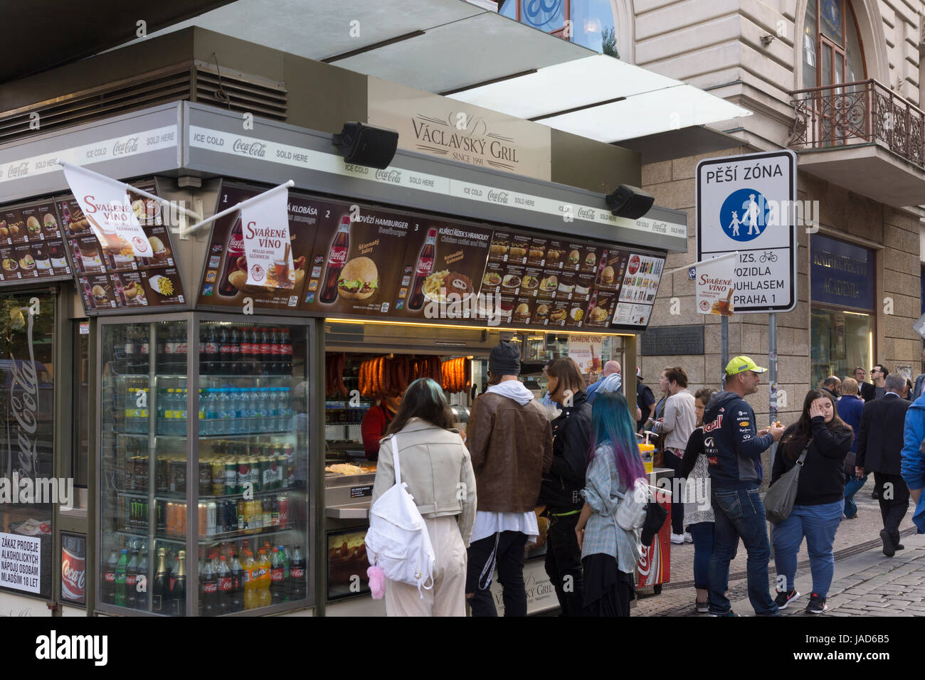 Customers queuing up outside Václavsky Gril, fast food kiosk, Prague ...