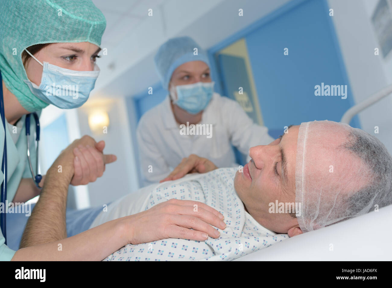 surgeons with patient Stock Photo - Alamy