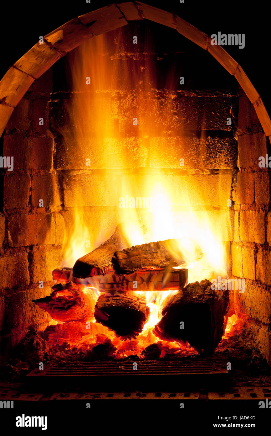 flames of fire in fireplace in evening time Stock Photo - Alamy