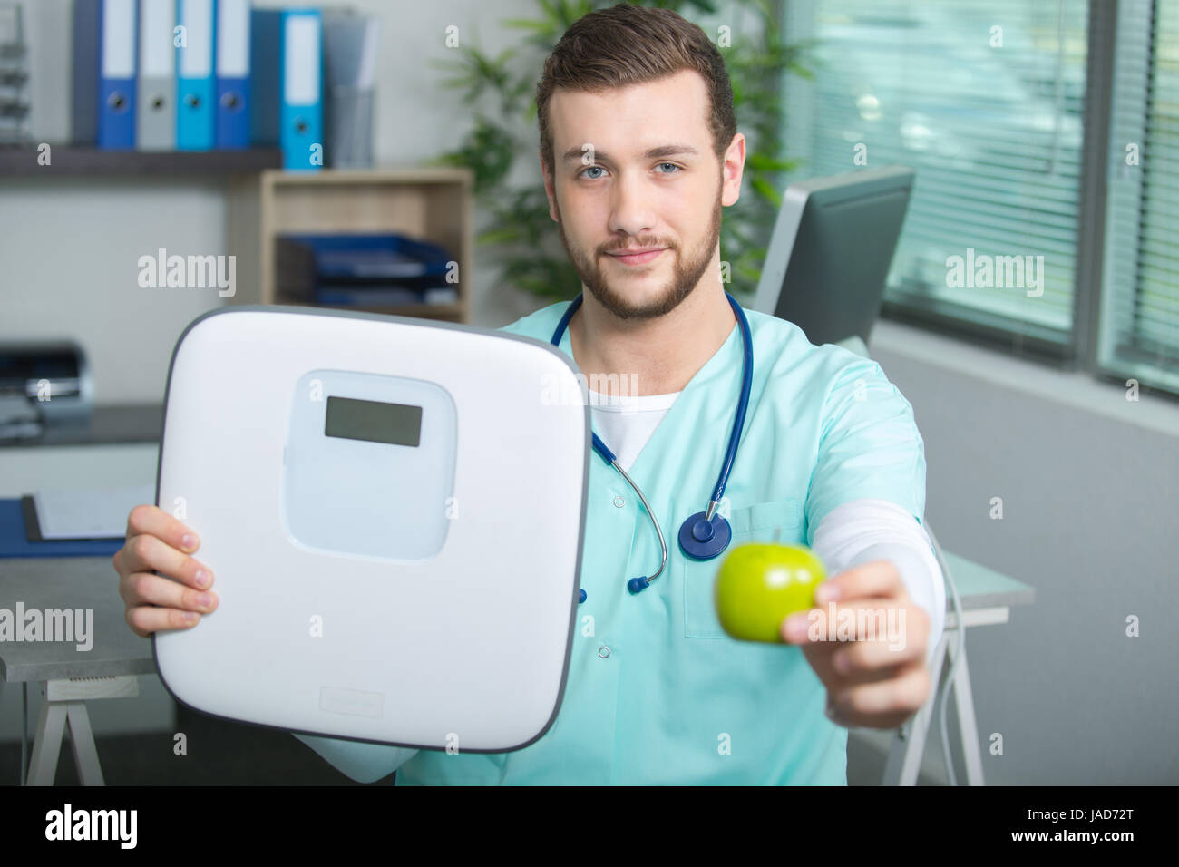 doctor with scales and apple over health care background Stock Photo ...