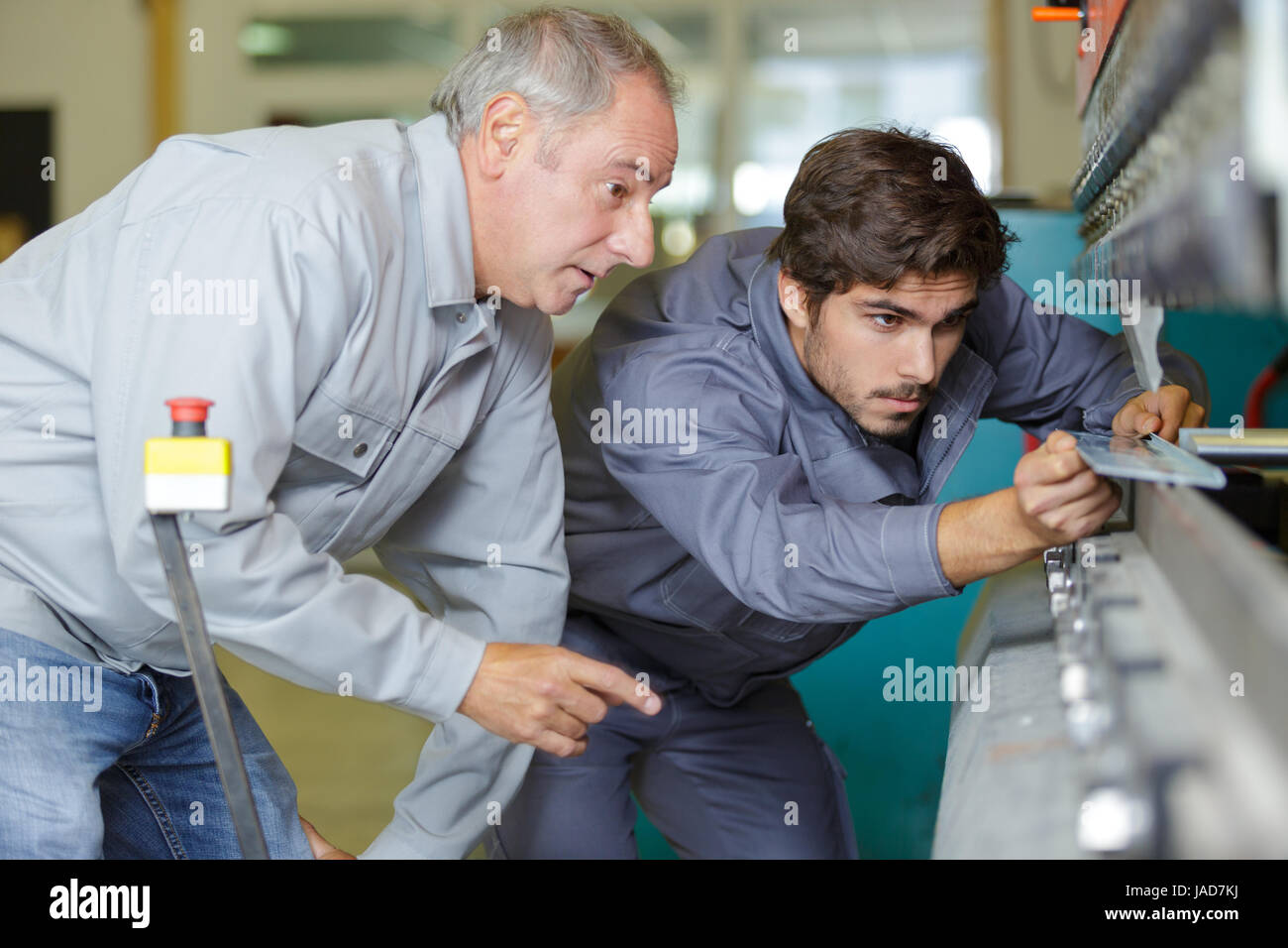 apprentice mechanical technician measuring cutting tool at tool ...