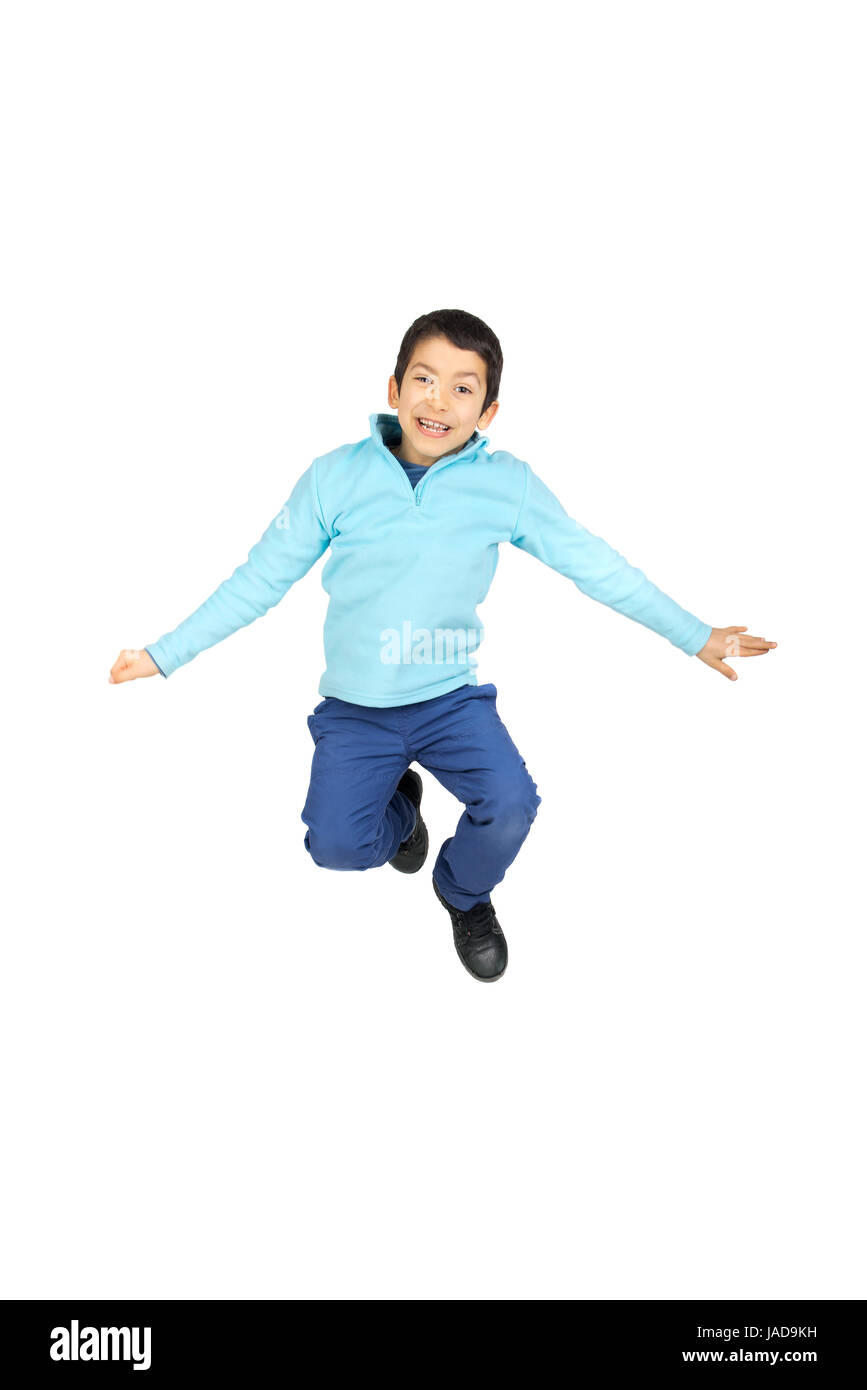 Young boy jumping isolated in white Stock Photo - Alamy