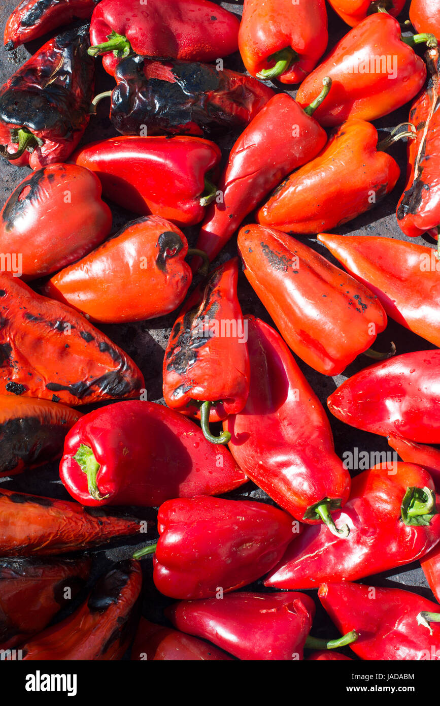 Roasted red peppers background. Sun light Stock Photo - Alamy