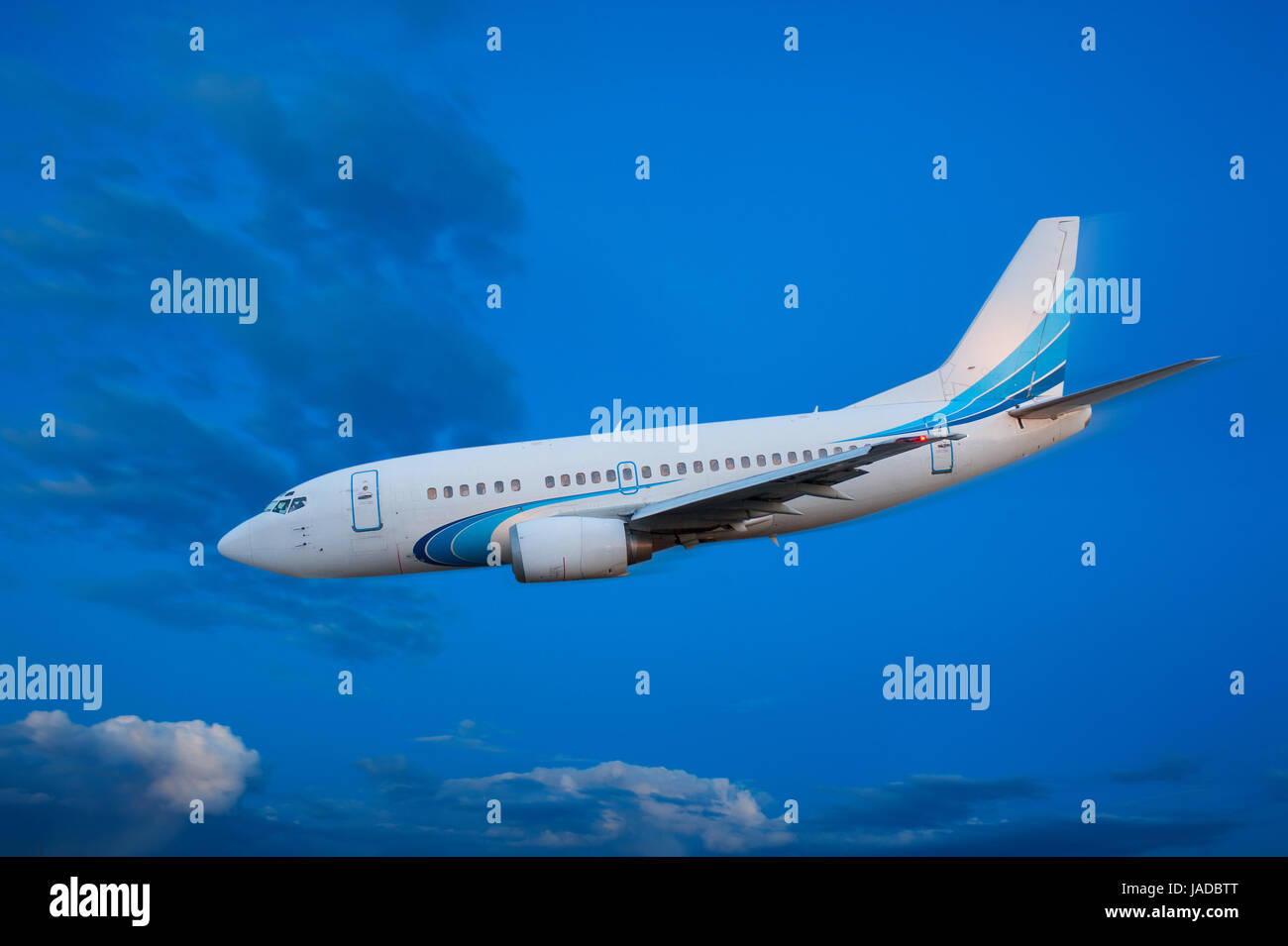 Large passenger plane flying in the blue sky Stock Photo - Alamy