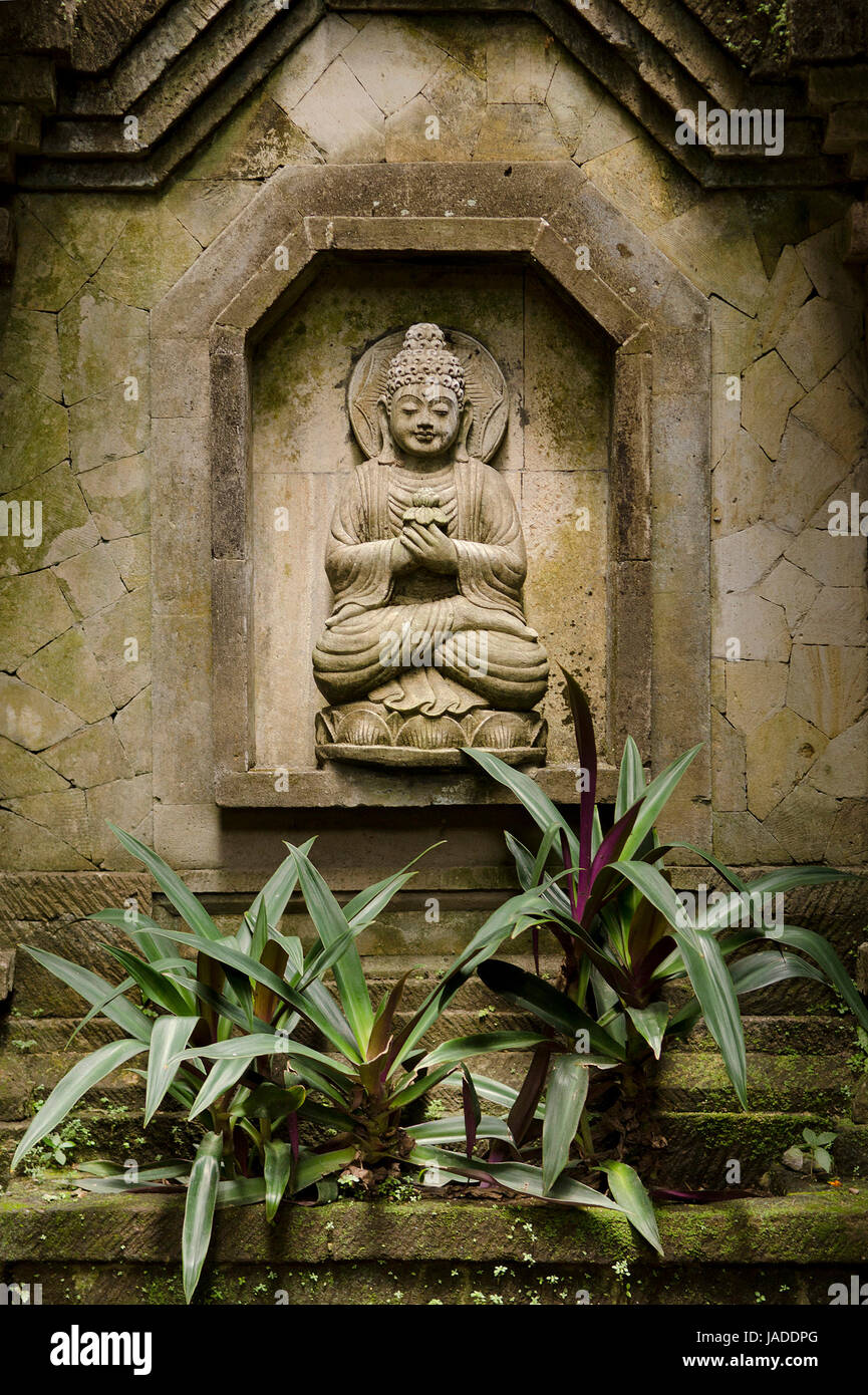 old stone statue of buddha in bali indonesia Stock Photo - Alamy