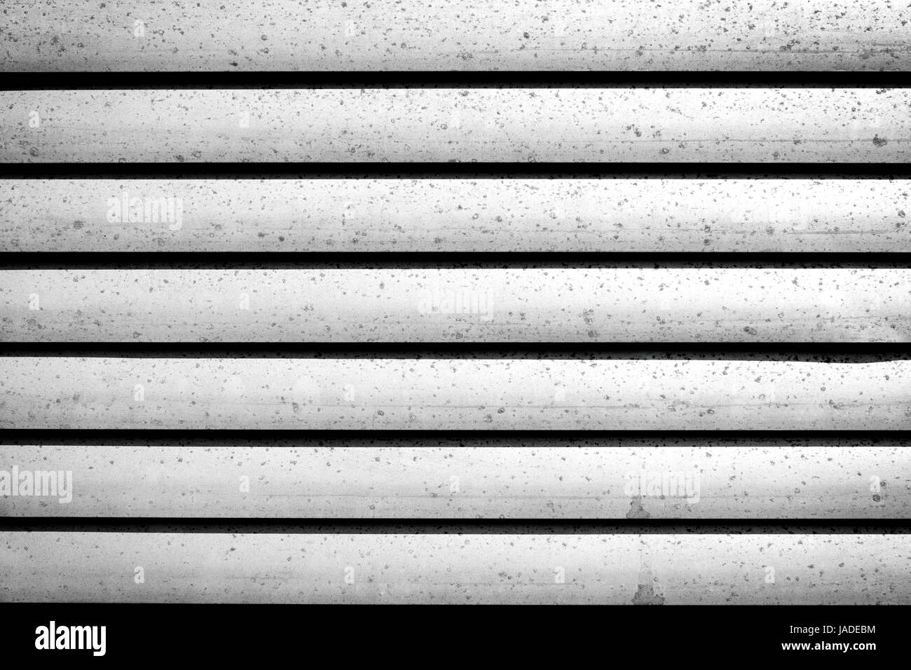 grey shutters over a shop doors - texture Stock Photo - Alamy