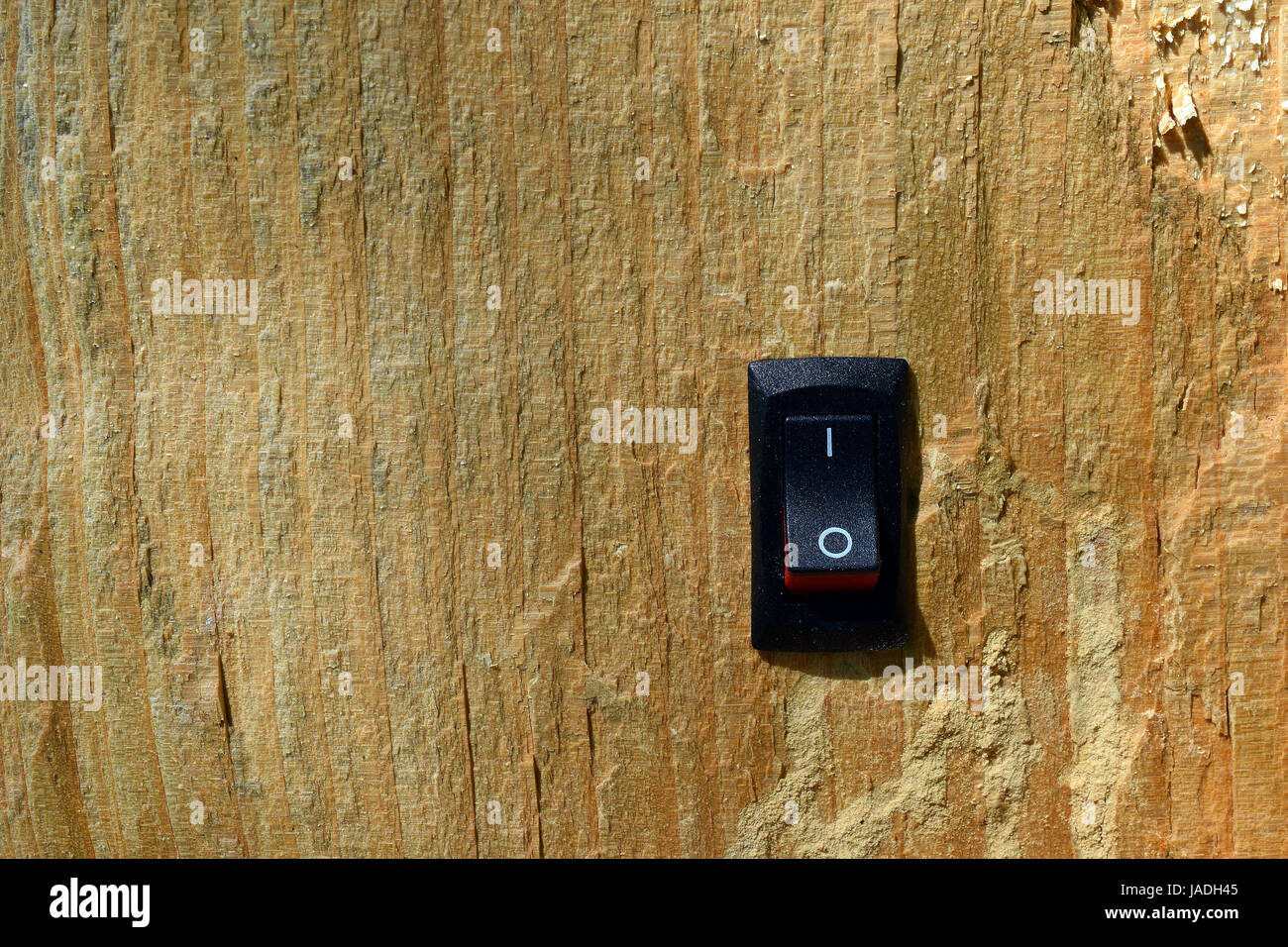 Power switch inserted on wood. Conservation, green business and ...
