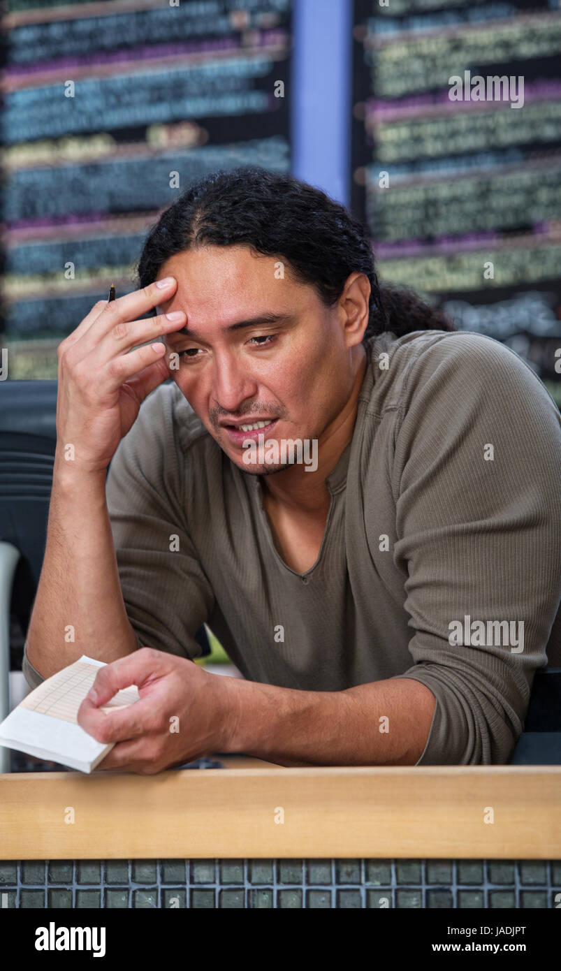 Stressed out male restaurant worker at counter Stock Photo - Alamy