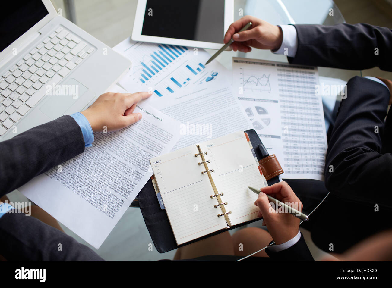 Image of human hands during work planning at meeting Stock Photo - Alamy