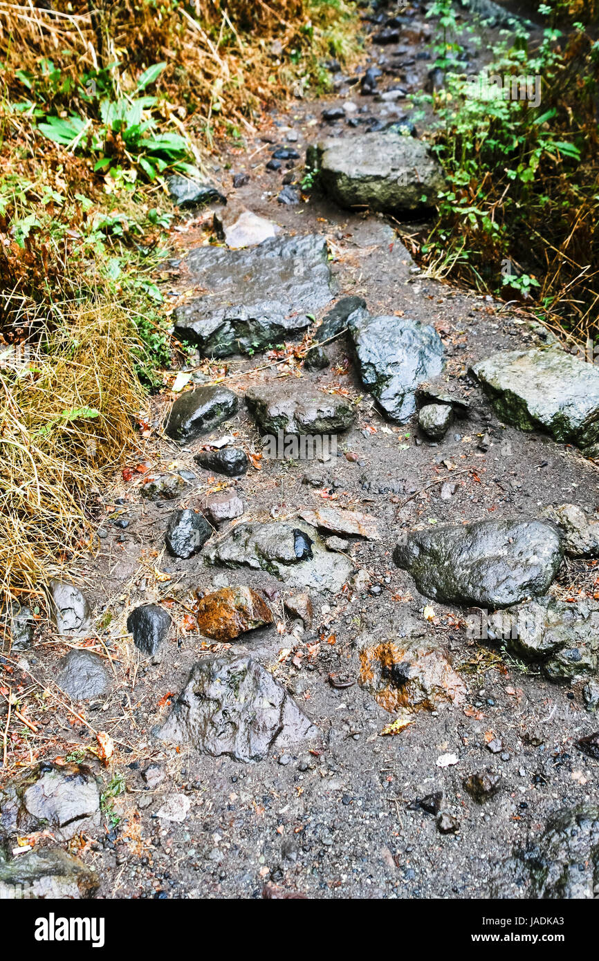 wet stones at mountain path in Geghard monastery in rain, in Armenia ...