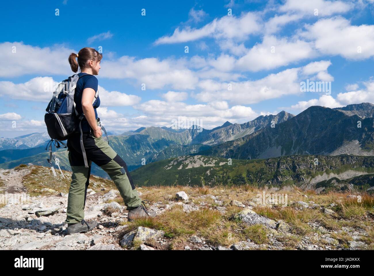 Hiking young person in mountains - relax scene Stock Photo - Alamy