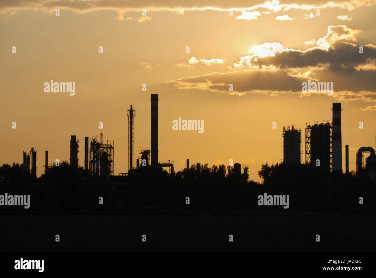 Oil refinery at sunset Stock Photo - Alamy