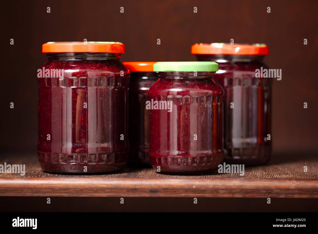 Jars of jam on a shelf Stock Photo - Alamy