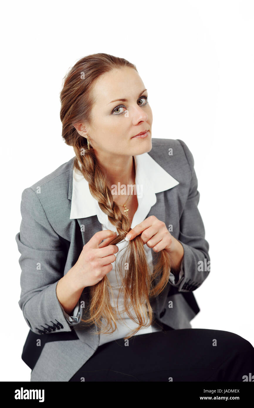 Middle age business woman with hands doing a braid a long mane on a ...