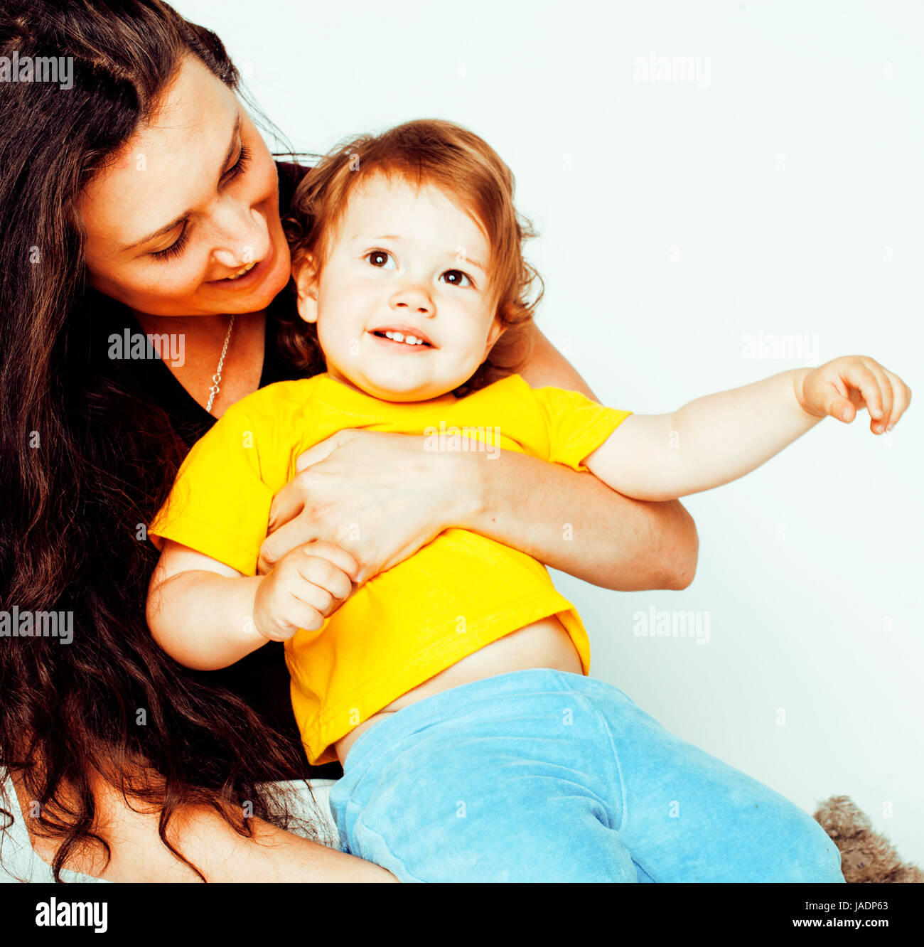 pretty real normal mother with cute blond little daughter close up ...