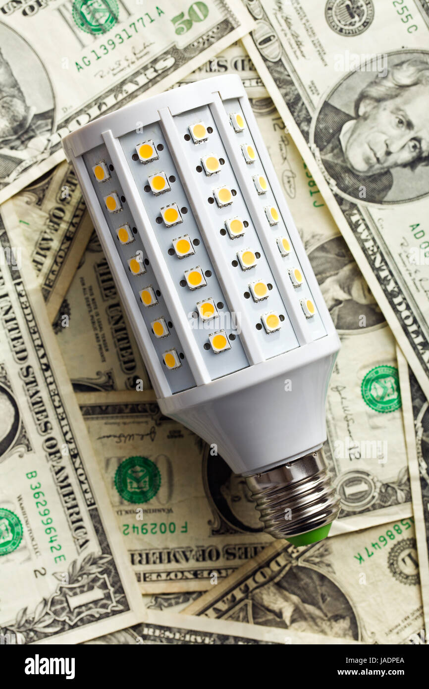 top view of LED lightbulb with american dollars Stock Photo - Alamy