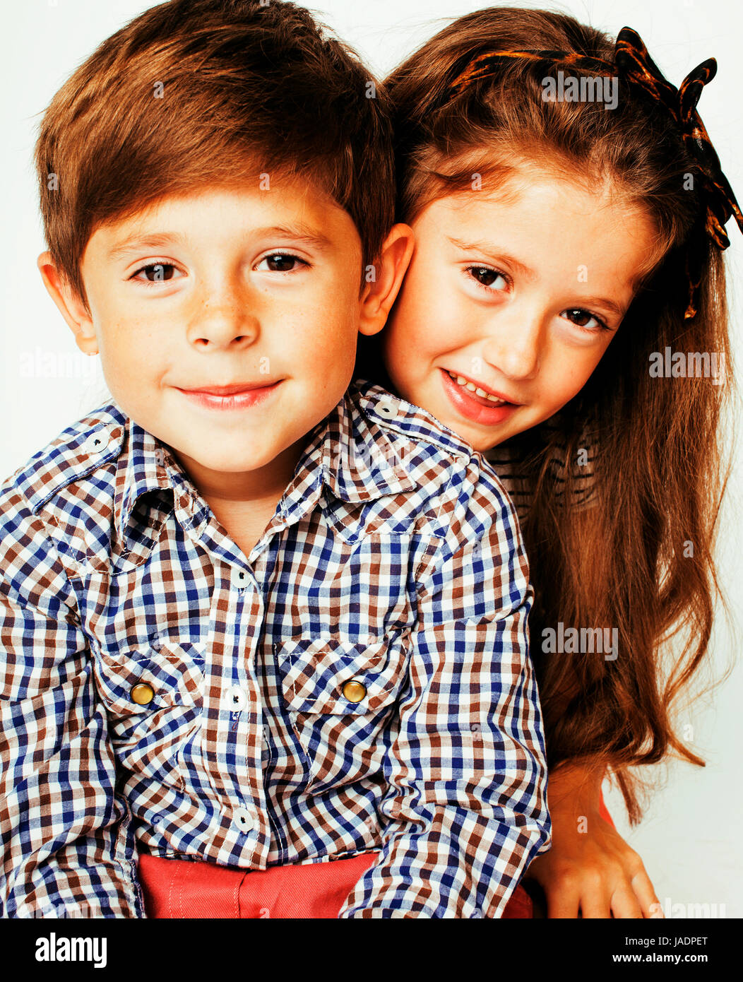 little cute boy and girl hugging playing on white background, ha Stock Photo - Alamy