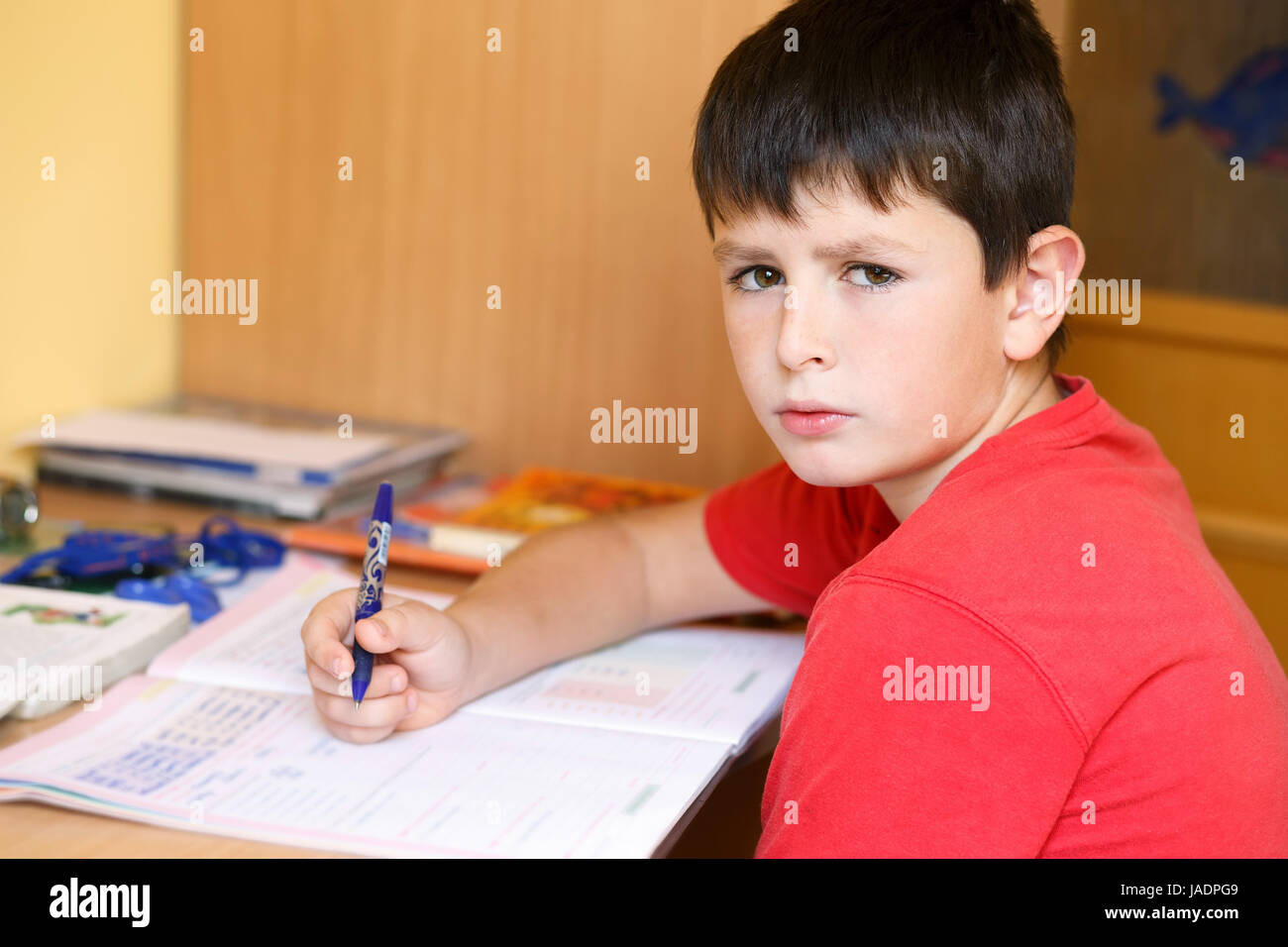 Teen boy doing homework desk hi-res stock photography and images - Alamy