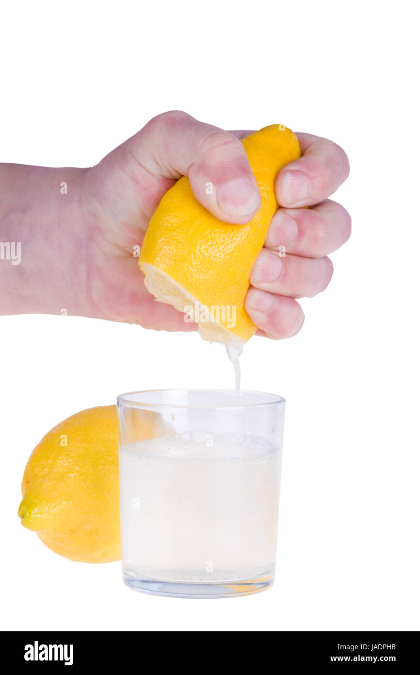 Squeezing lemon on white bacground Stock Photo - Alamy