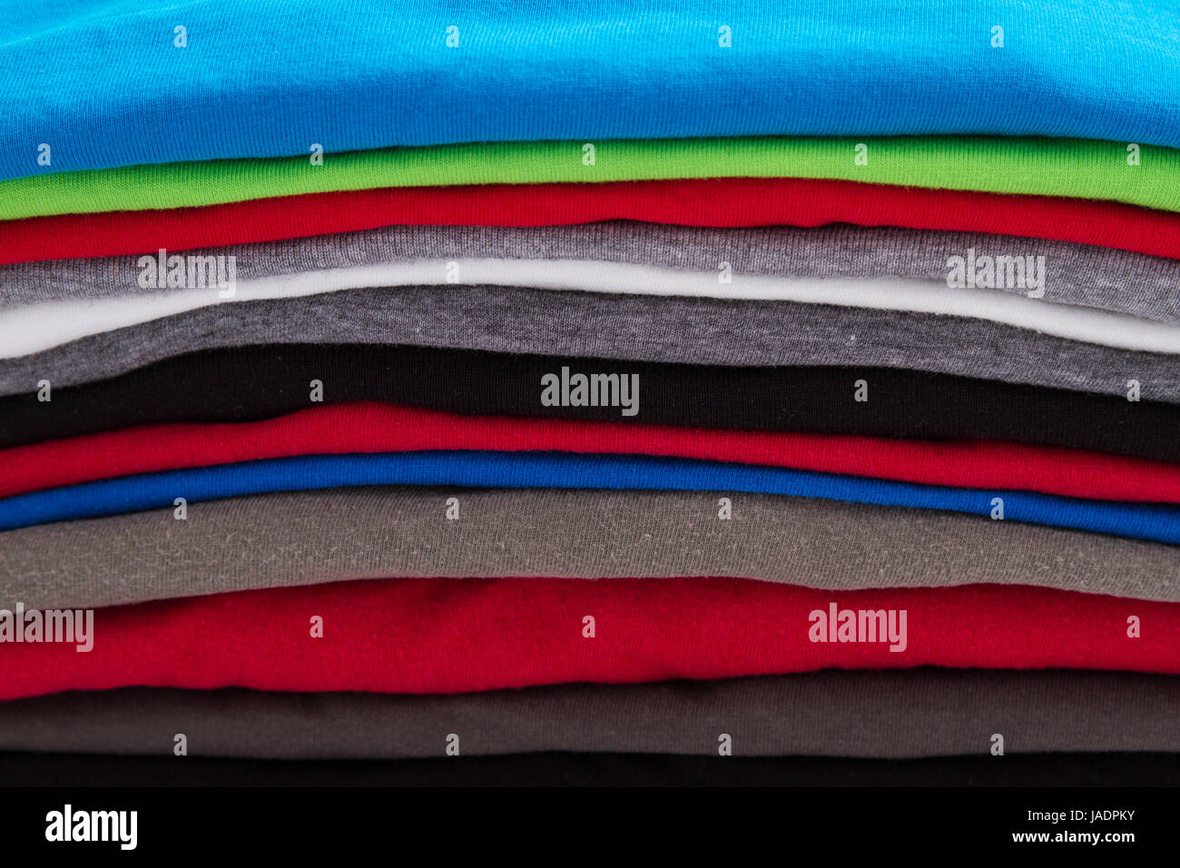 A pile of folded T shirts Stock Photo - Alamy