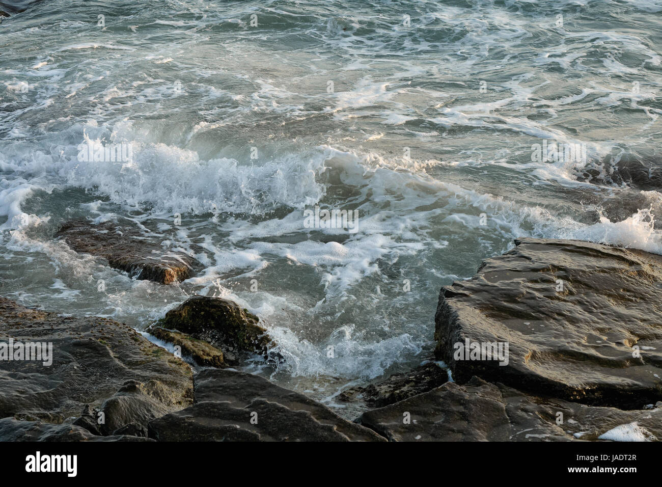 Waves of the Caspian Sea are fighting on the rocky shore Stock Photo ...
