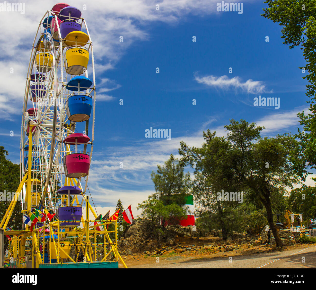 Ferris Wheel At County Fair Next To Colorful Water Tank Stock Photo - Alamy