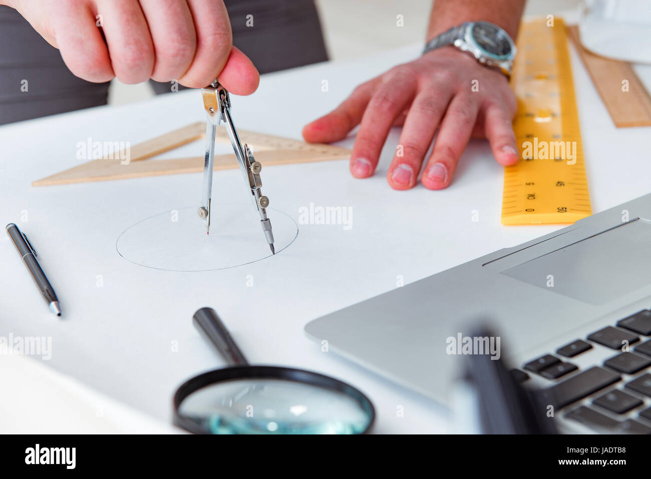Male engineer working on drawings and blueprints Stock Photo - Alamy