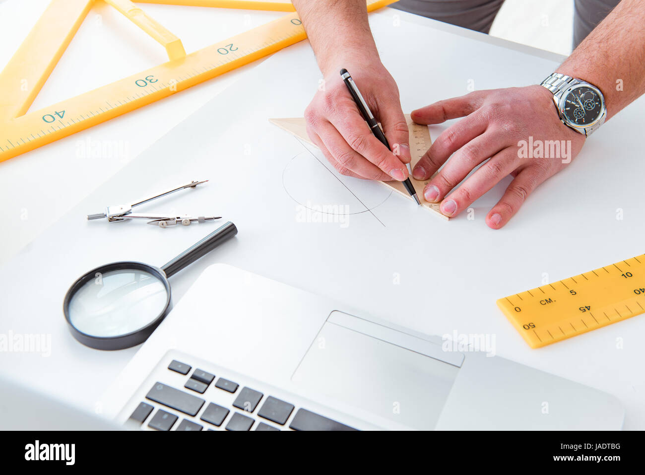 Male engineer working on drawings and blueprints Stock Photo - Alamy