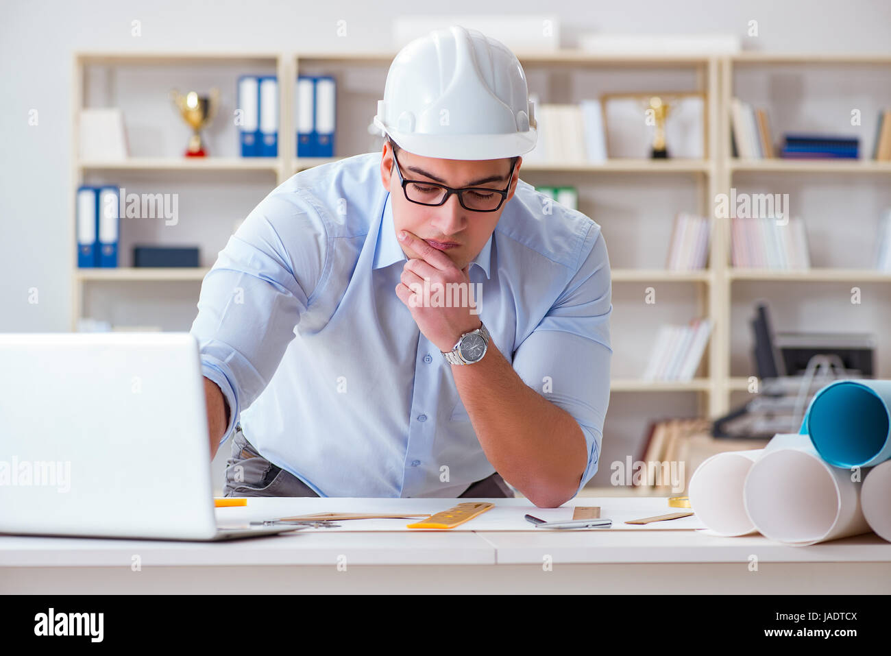 Male engineer working on drawings and blueprints Stock Photo - Alamy