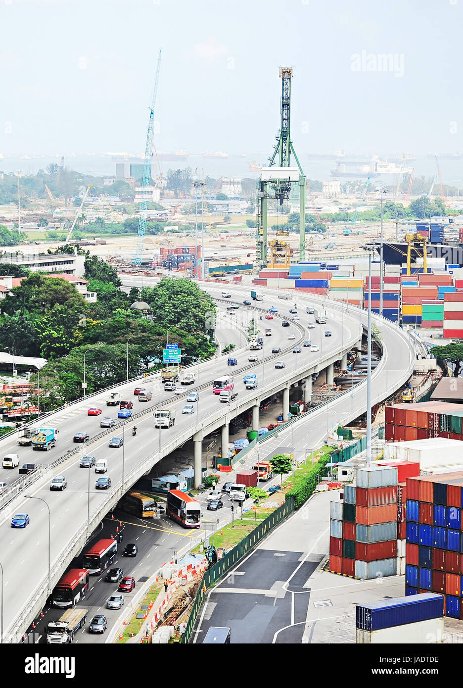 Singapore highway near commercial port . It's the world's busiest port ...