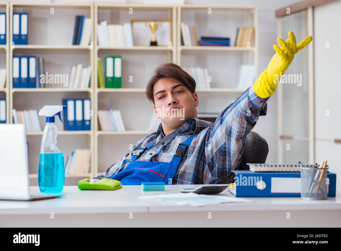 Male cleaner working in the office Stock Photo - Alamy