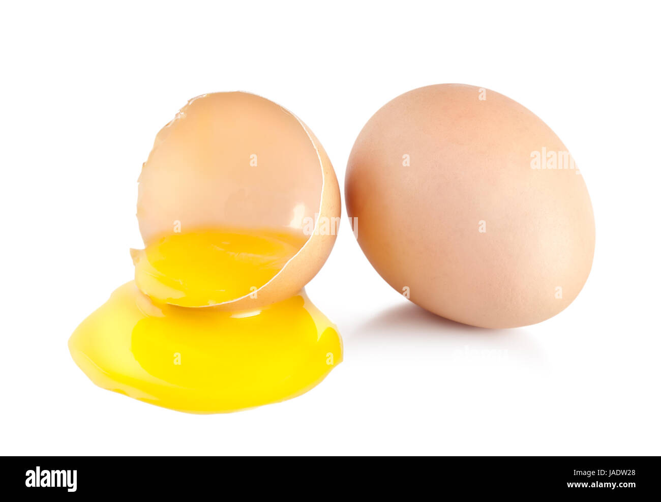 Broken egg with a yellow yolk isolated on white background Stock Photo ...
