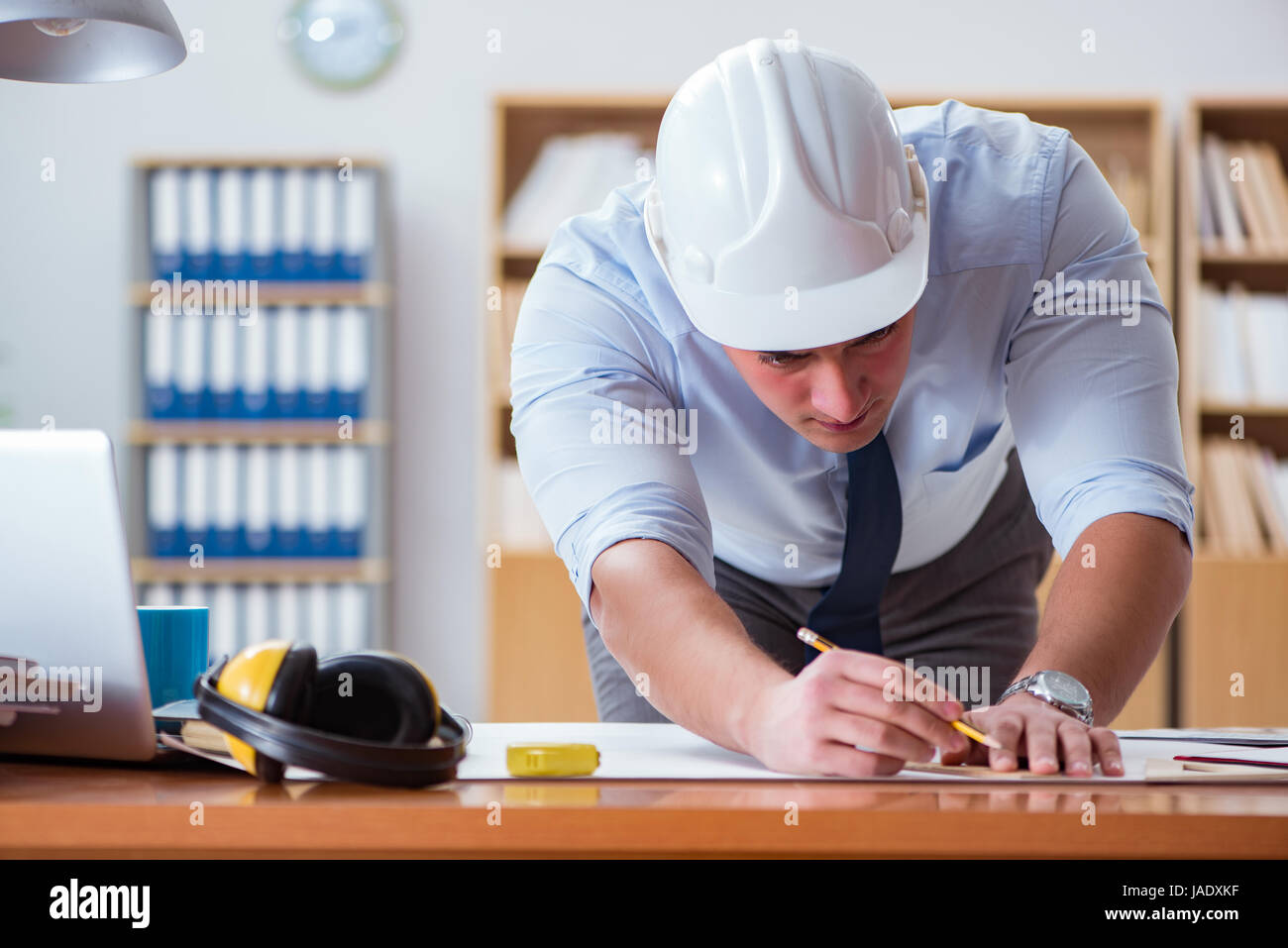 Engineer supervisor working on drawings in the office Stock Photo - Alamy
