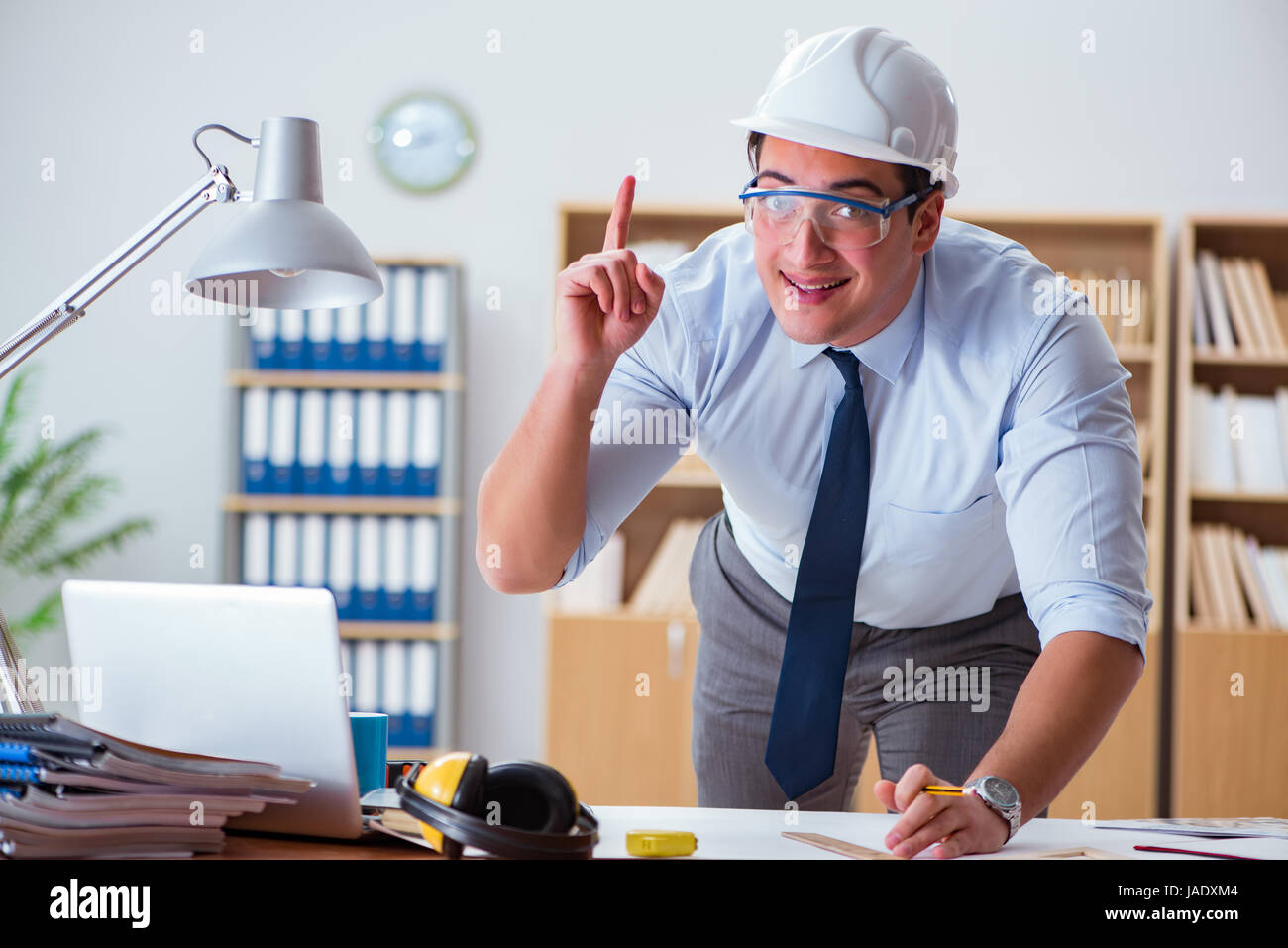 Engineer supervisor working on drawings in the office Stock Photo - Alamy
