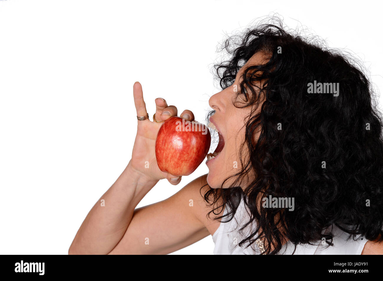 Portrait of beautiful woman eating an apple. Isolated white background ...