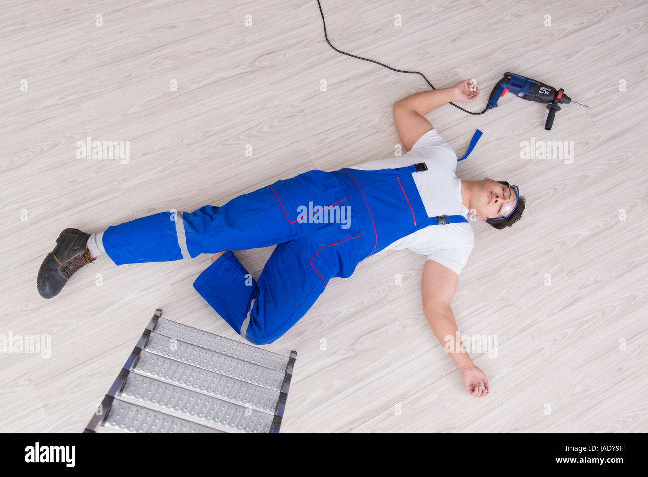 Worker after falling from height - unsafe behavior Stock Photo - Alamy