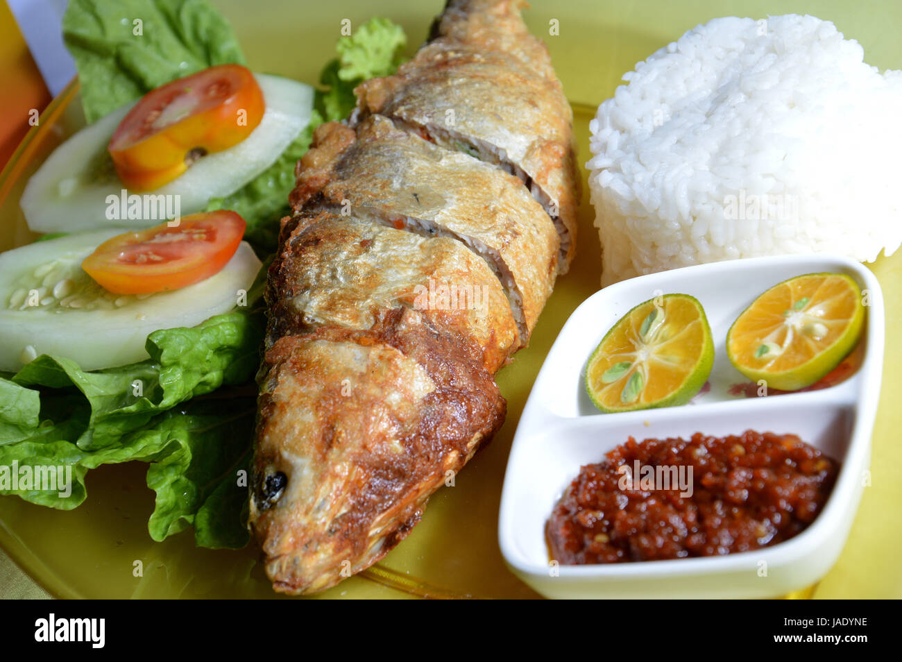 milkfish fry in the present white rice and fresh vegetables Stock Photo ...