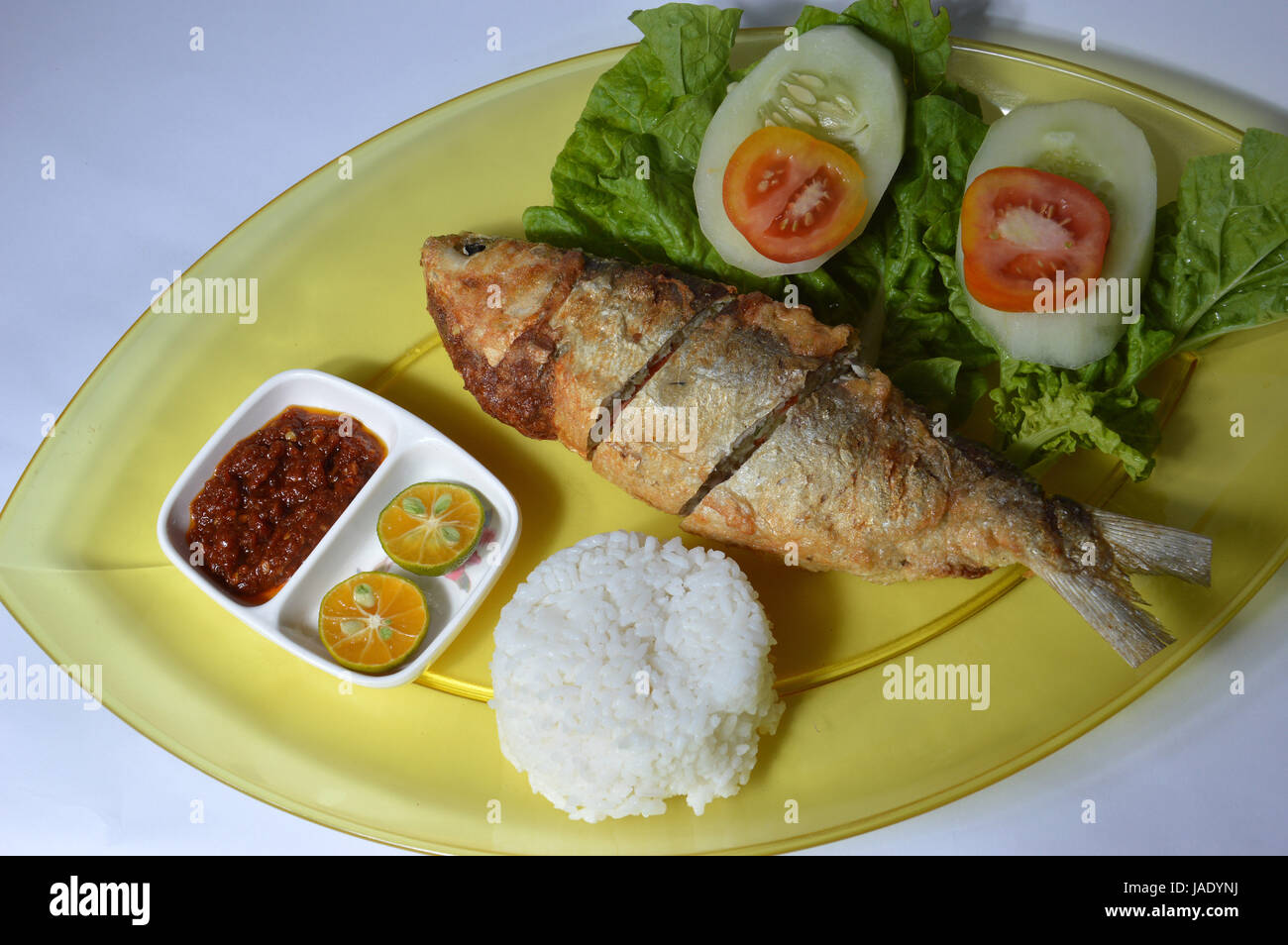milkfish fry in the present white rice and fresh vegetables Stock Photo ...