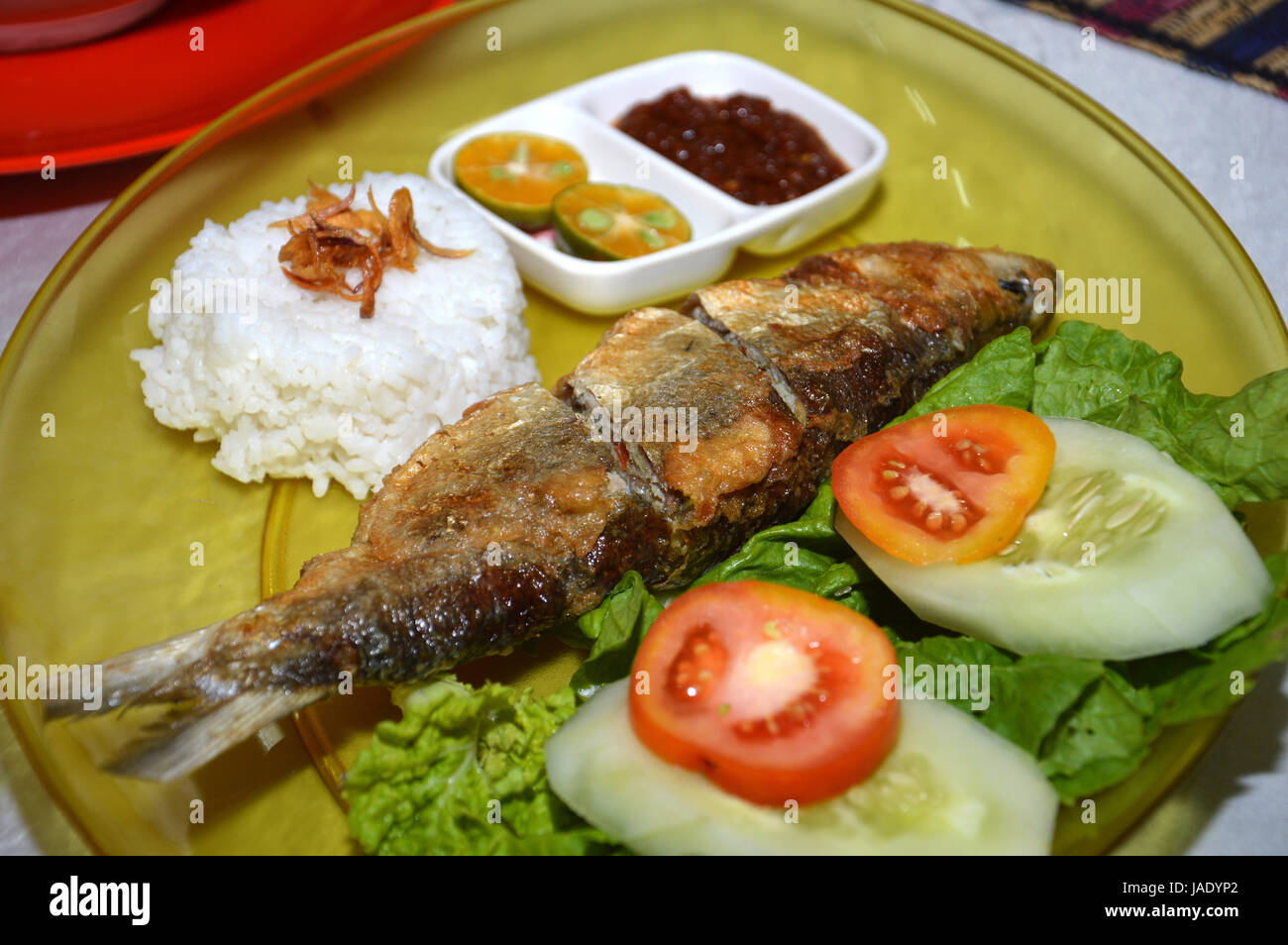 milkfish fry in the present white rice and fresh vegetables Stock Photo ...