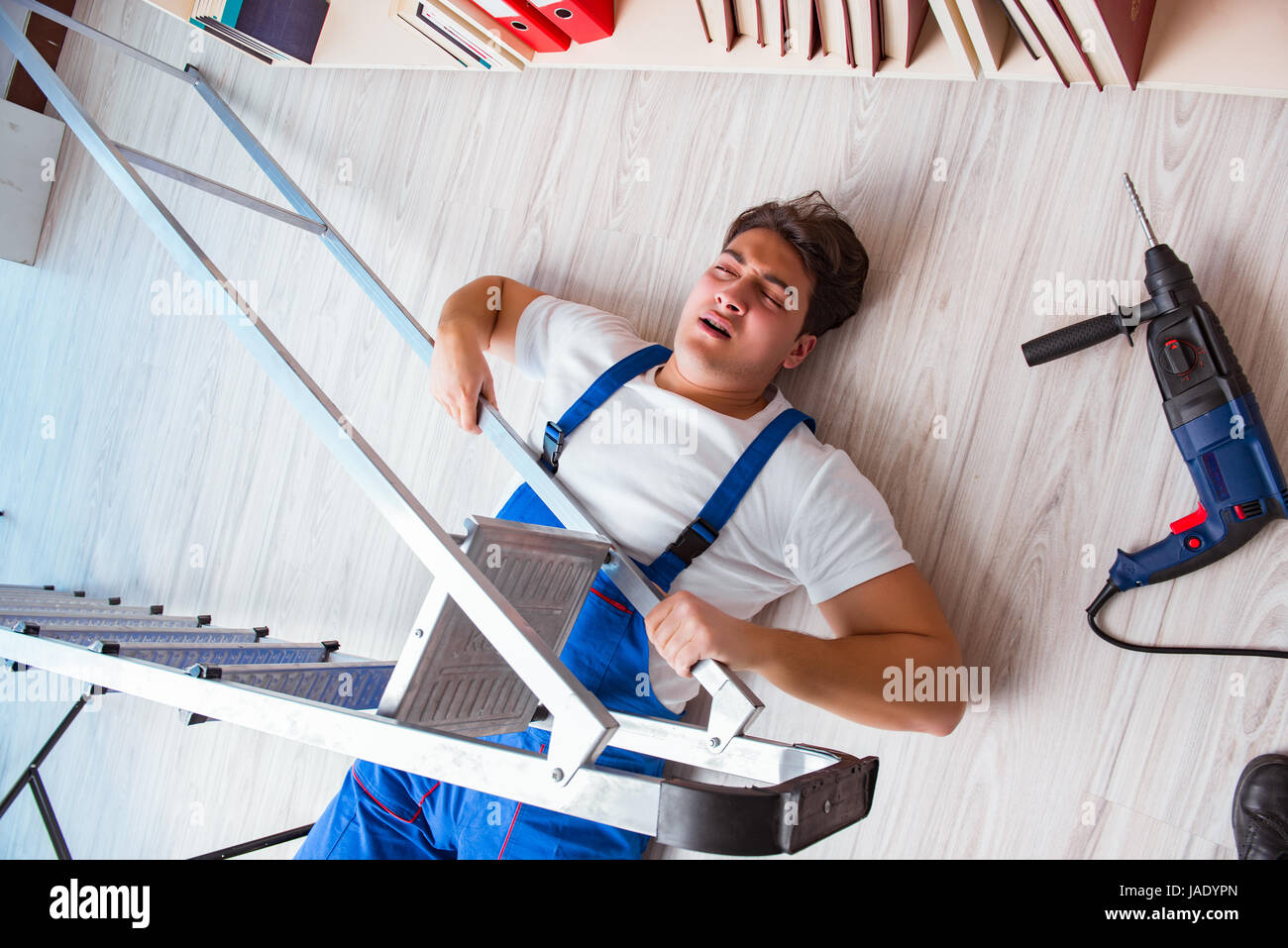 Unsafe behavior concept with falling worker Stock Photo - Alamy