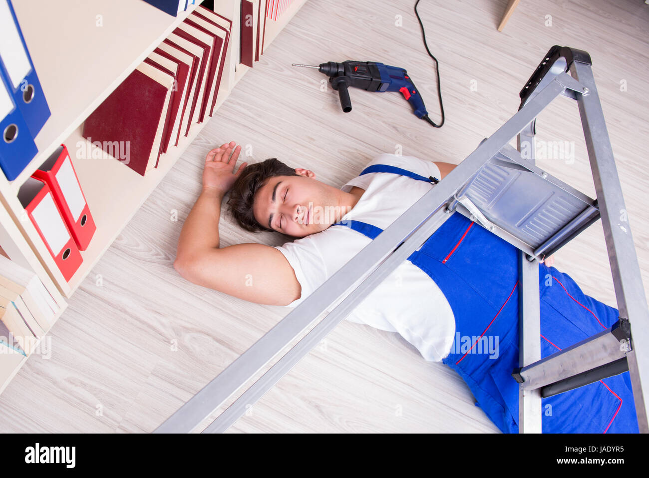 Unsafe behavior concept with falling worker Stock Photo - Alamy